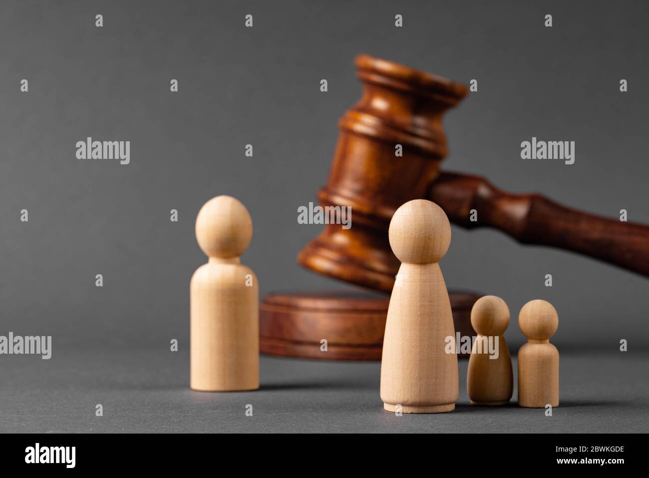 Wooden toy family and judge mallet. Family divorce concept Stock Photo ...