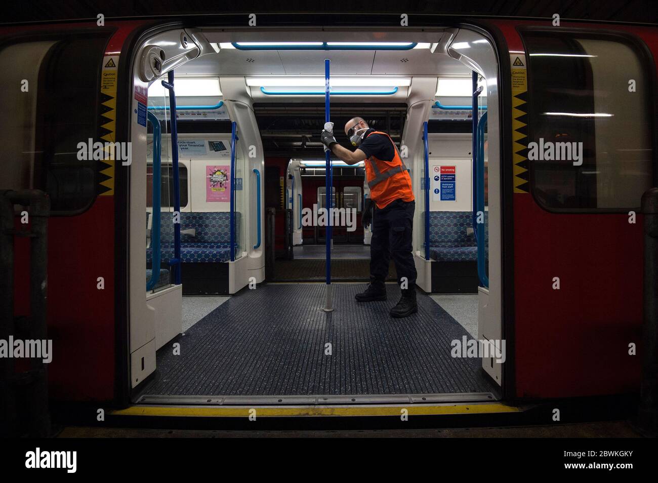 A TfL worker deep cleans a Victoria Line tube train at the London ...