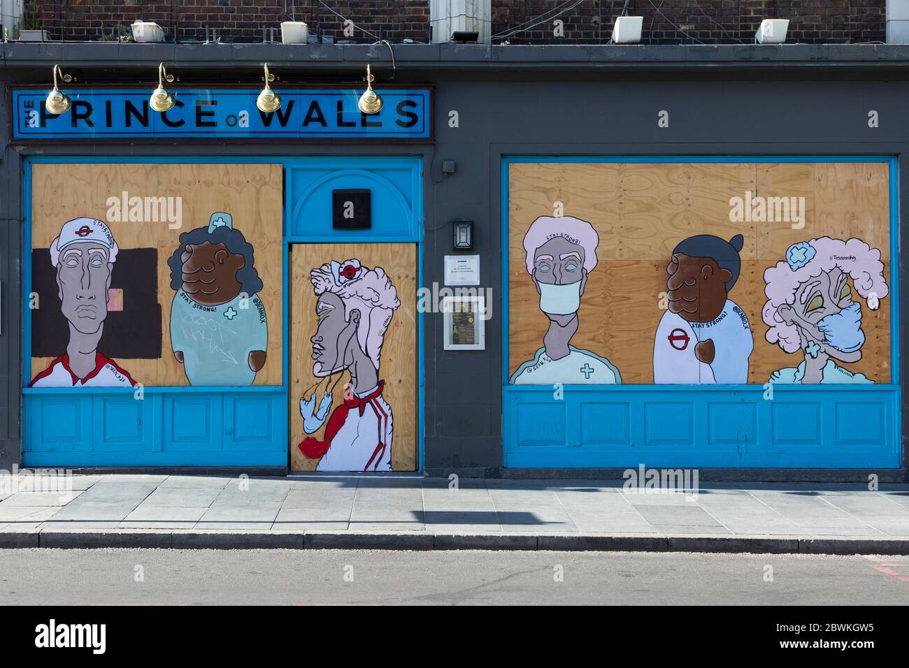 Street art portraits of essential workers outside the closed Prince of ...