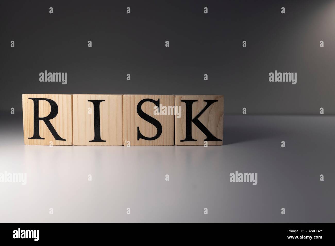 The word Risk was written with wooden cubes Stock Photo - Alamy