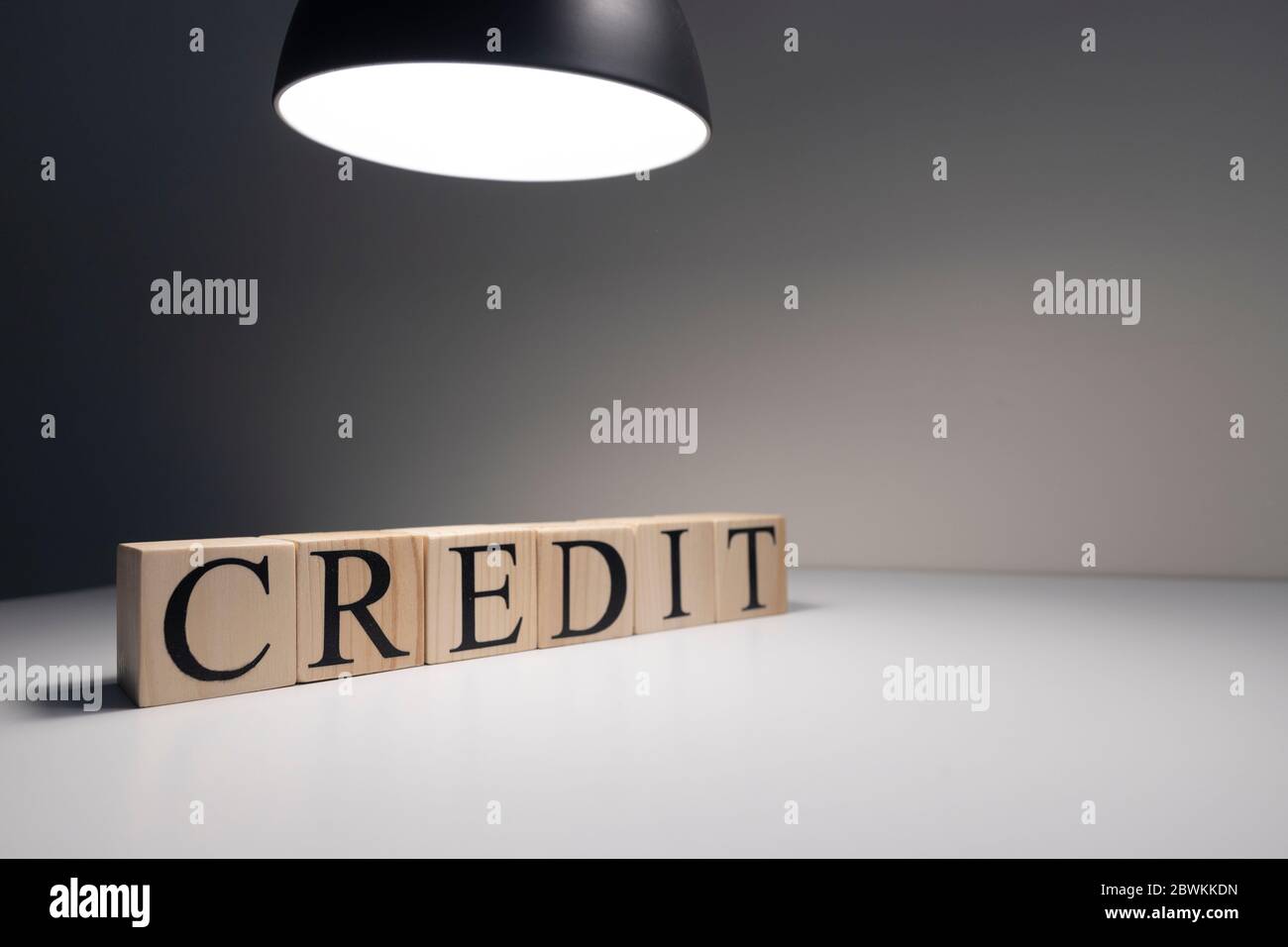The word credit from wooden blocks. Business and banking concept. Spot ...