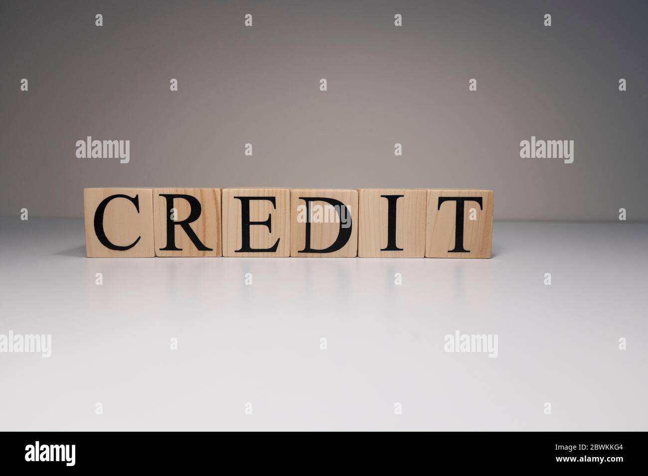 The word credit from wooden blocks. Business and banking concept. Spot ...
