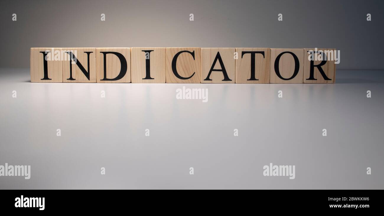 Indicator word from wooden blocks. Business and banking concept. Spot ...