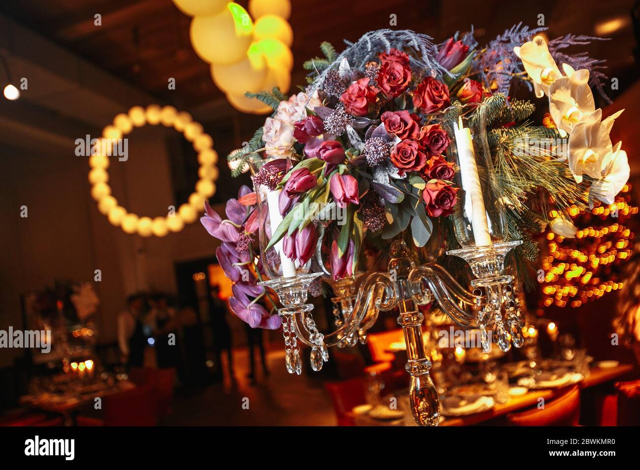 A vaz with flowers on the bar with glasses and wine Stock Photo - Alamy