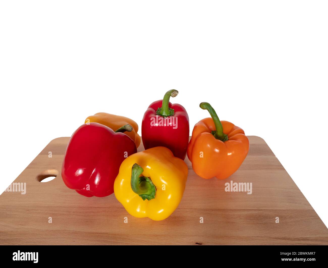 Different colored pepper on a white background Stock Photo - Alamy
