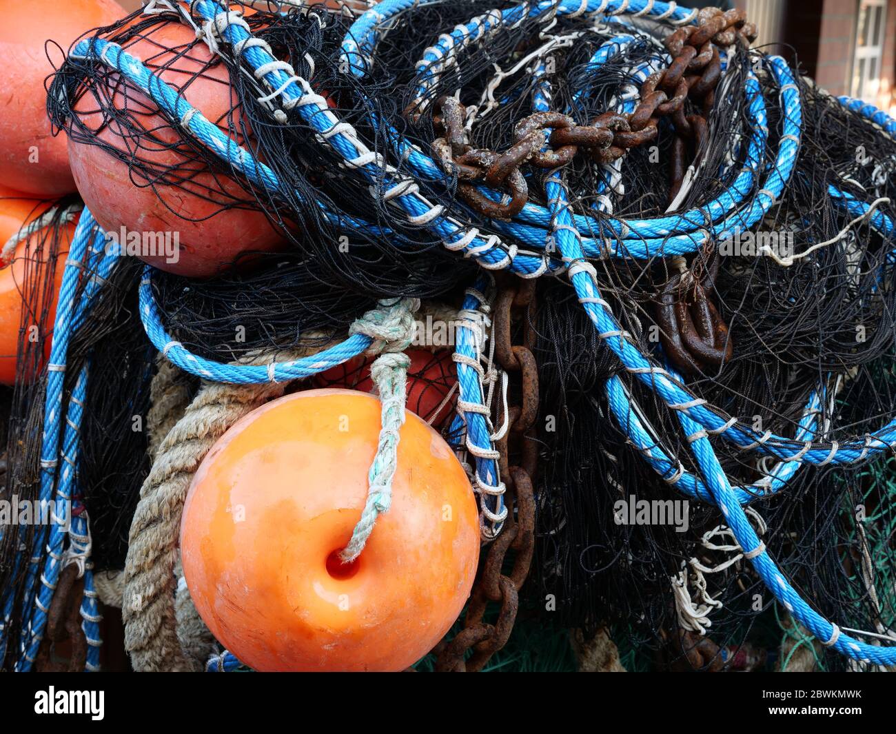 Fishing net with buoys, ropes and chains Stock Photo - Alamy