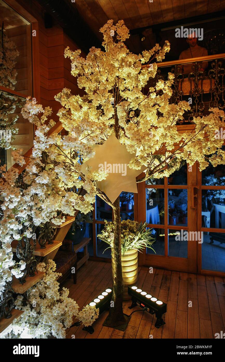 White decorative tree in the restaurant Stock Photo - Alamy