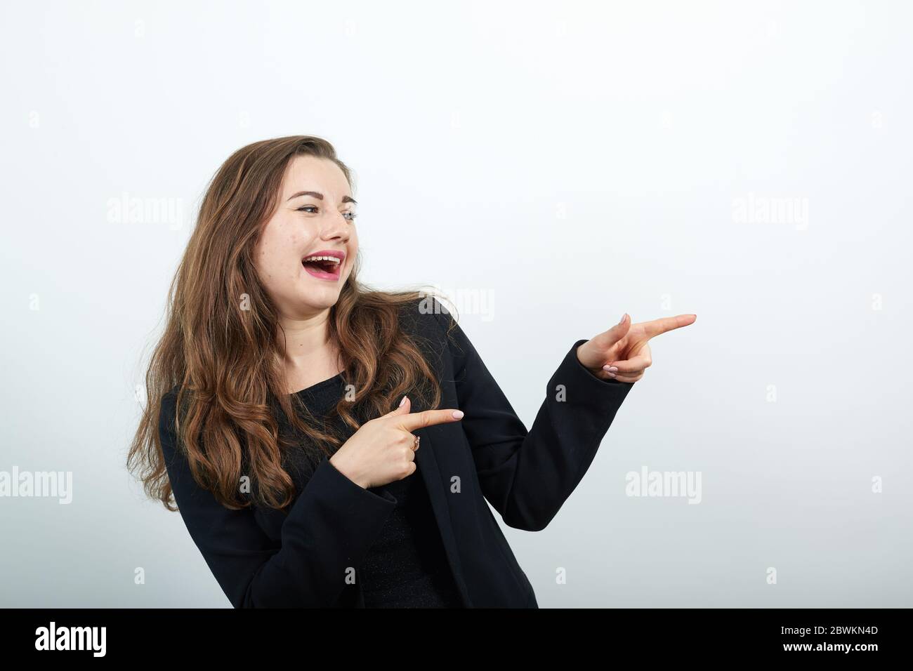 pointing her hand in the direction demonstrates your product showing ...