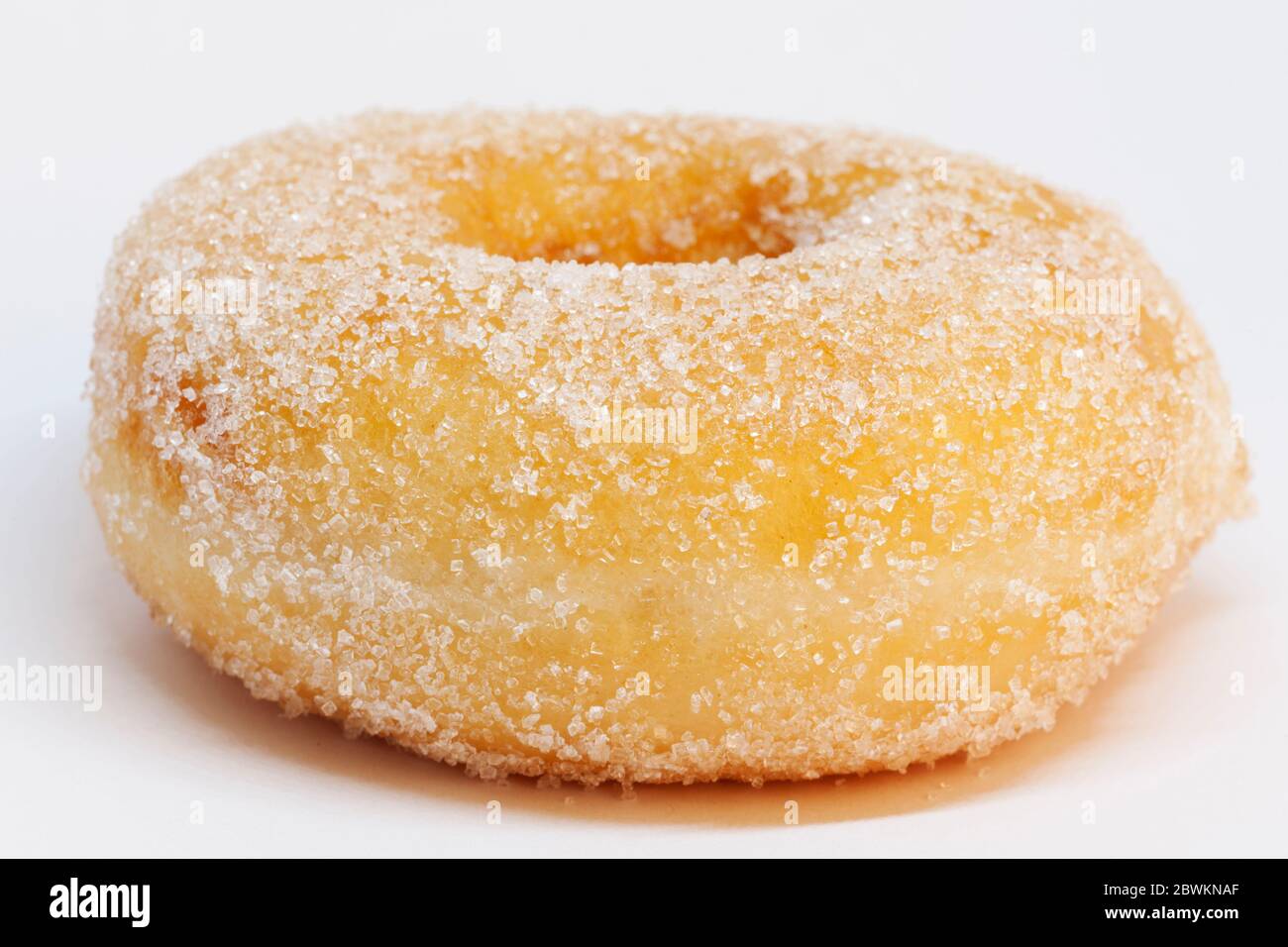 a donut with lots of sugar on white background Stock Photo - Alamy