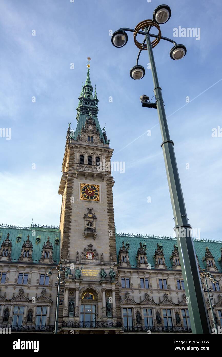 Clock tower of the historic town hall in the city of Hamburg against a ...