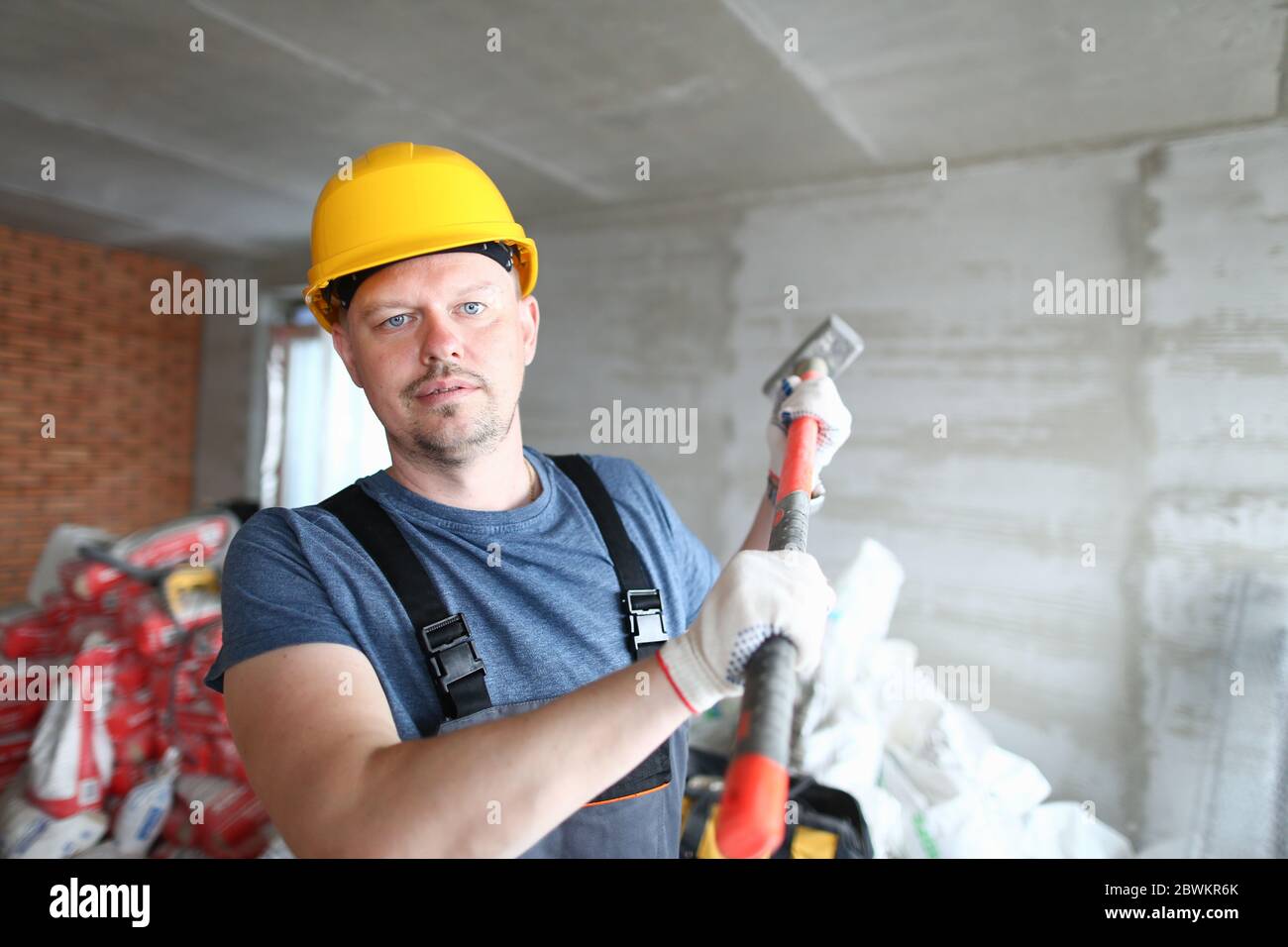 Real strong man working at building object Stock Photo - Alamy
