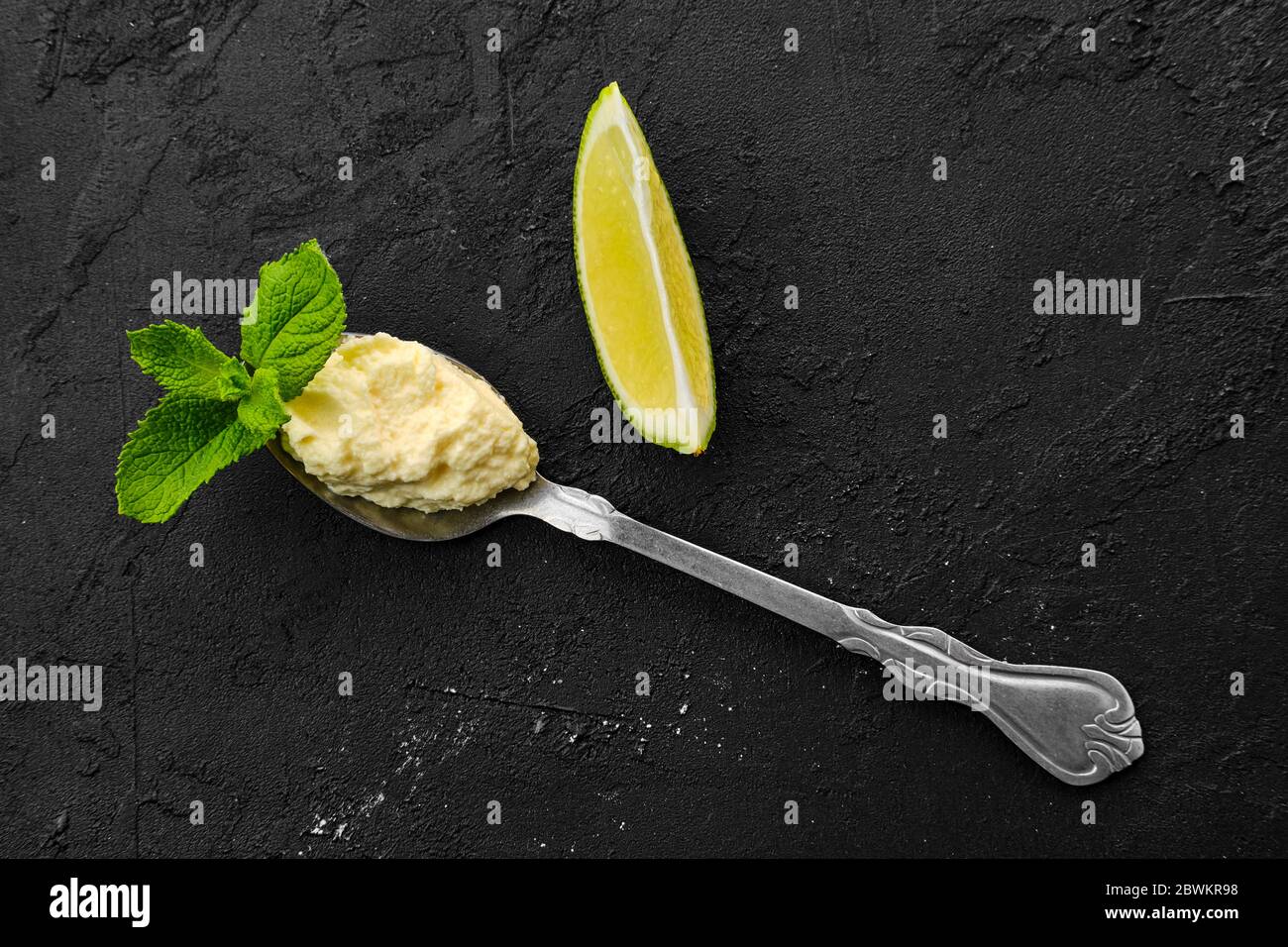 Small spoon with cream cheese Stock Photo - Alamy