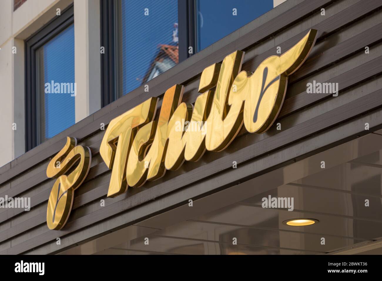 Stade, Germany - May 28, 2020: Signage above entrance of Tchibo store ...