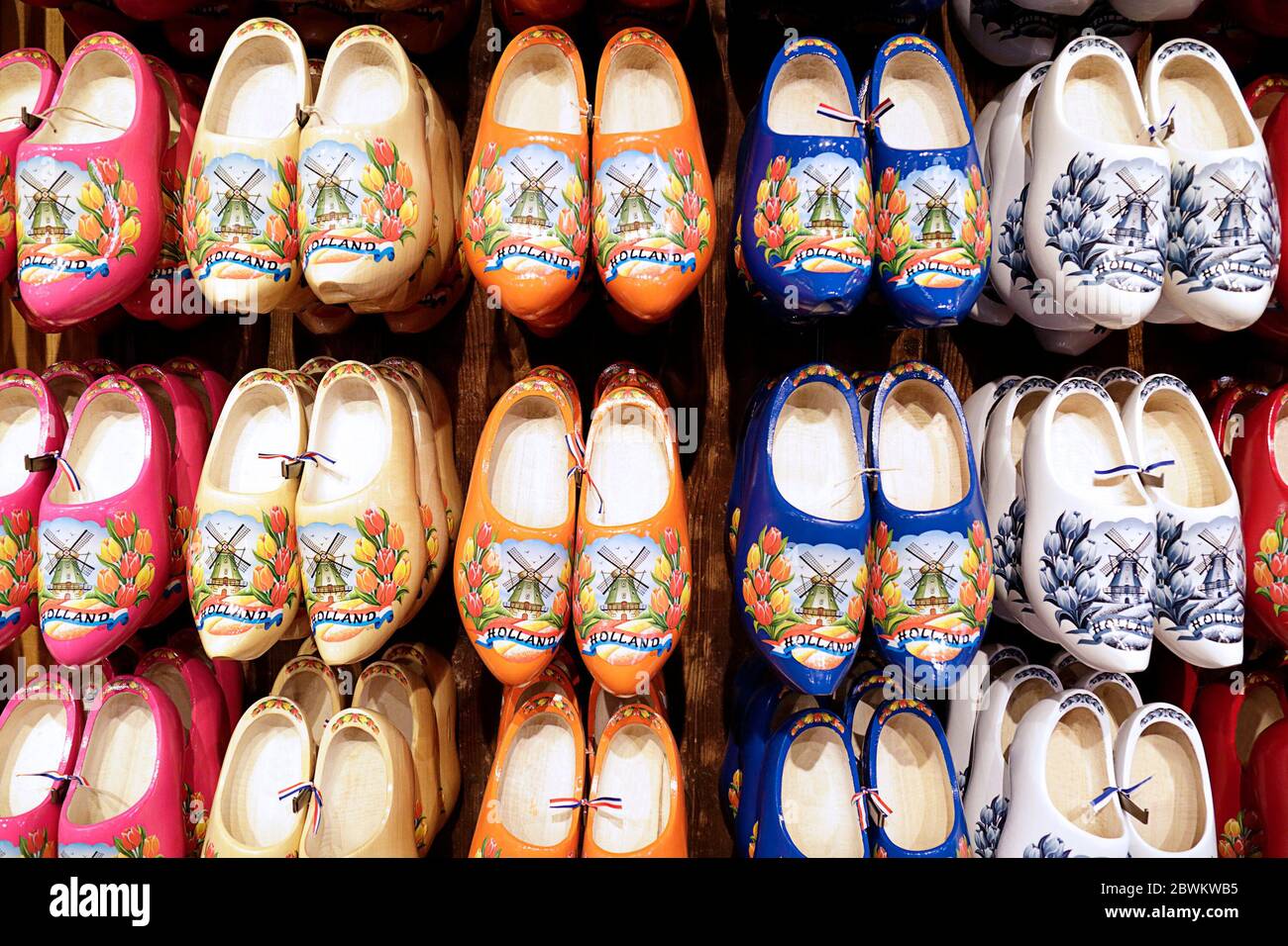 Rack in the store with rows traditional dutch wooden clogs Stock Photo ...
