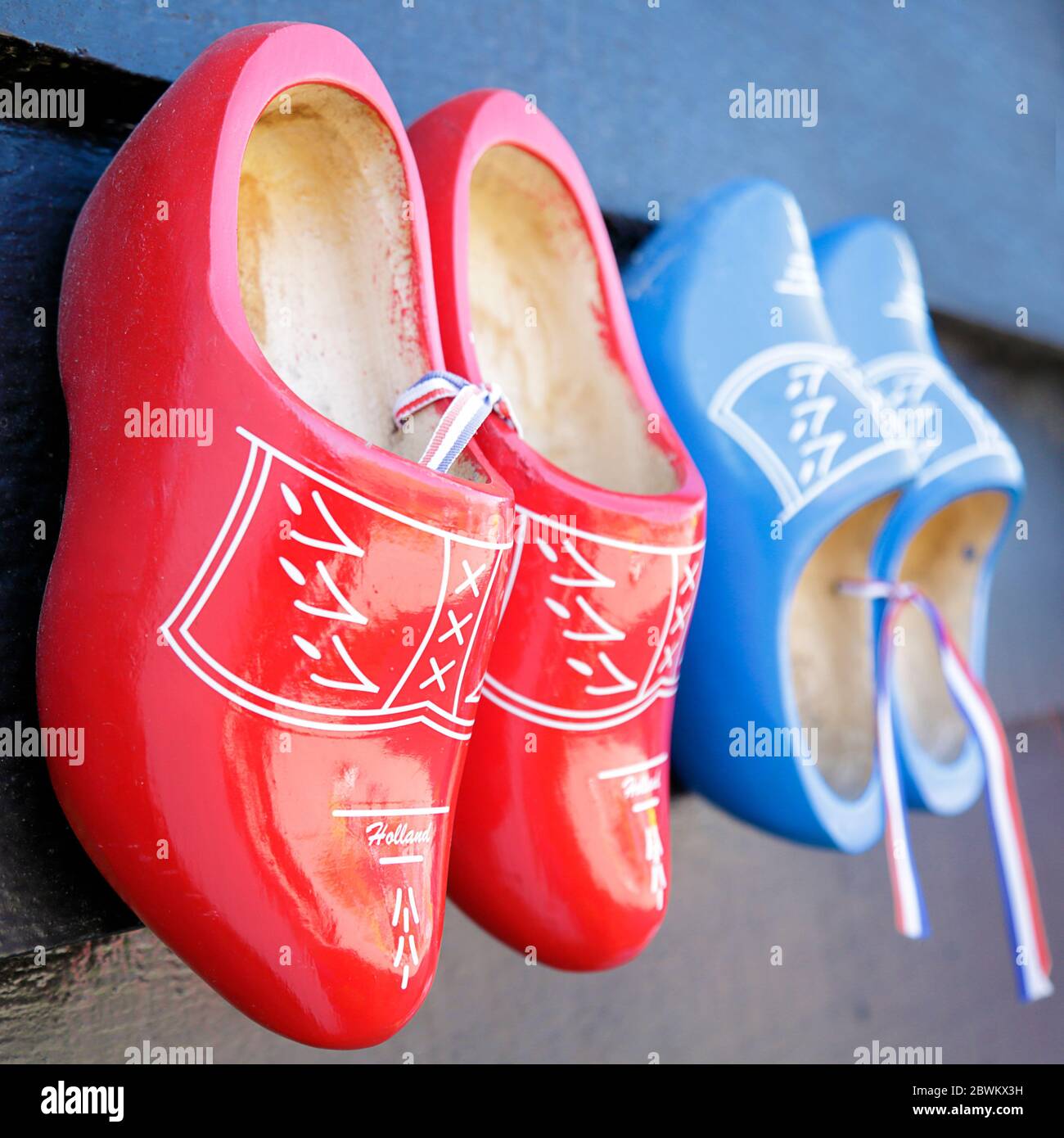 Traditional dutch wooden clogs hanging on a wall Stock Photo - Alamy
