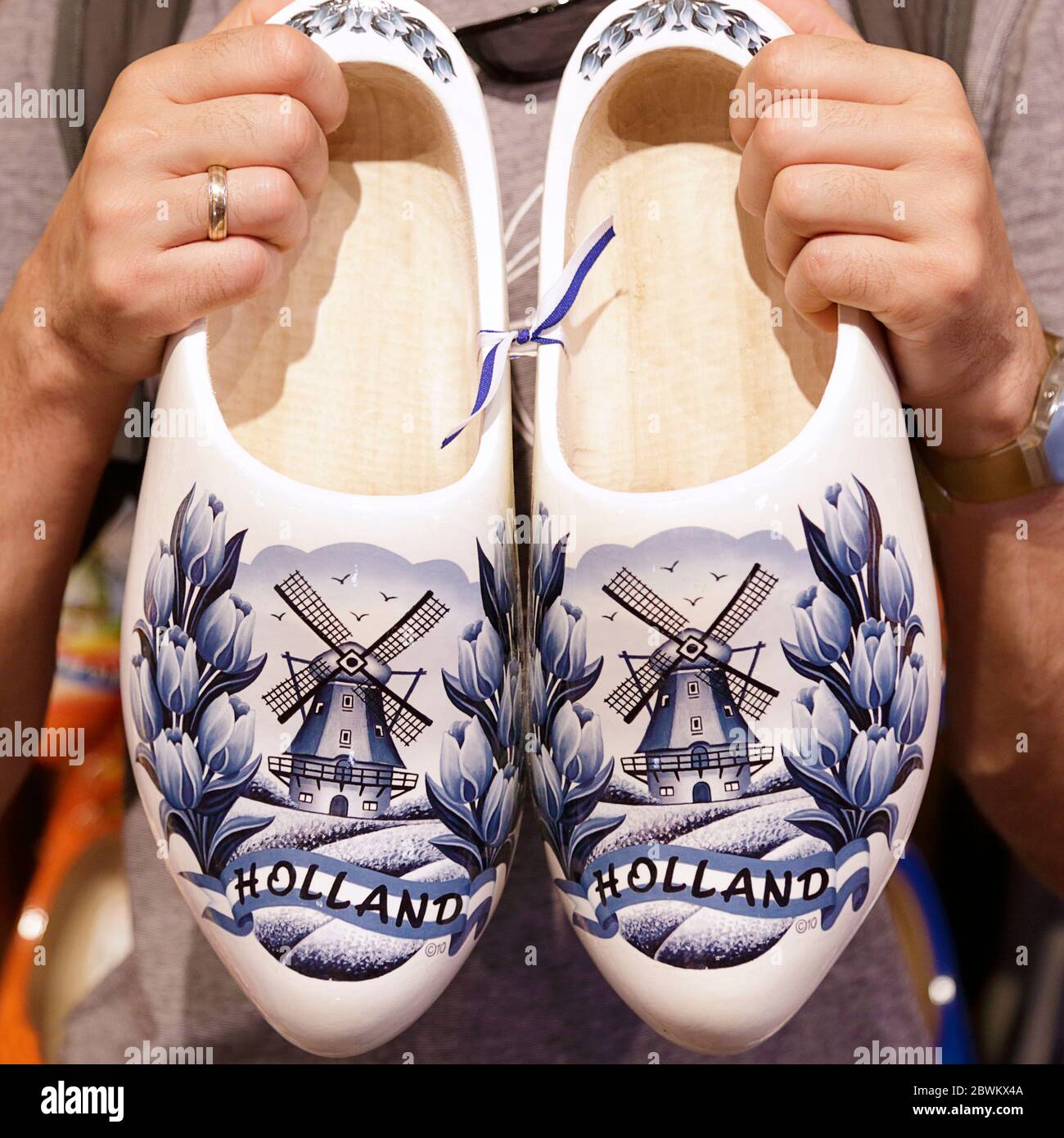 EDITORIAL Zaanse Schans, The Netherlands - July 30, 2019: Man showing a ...