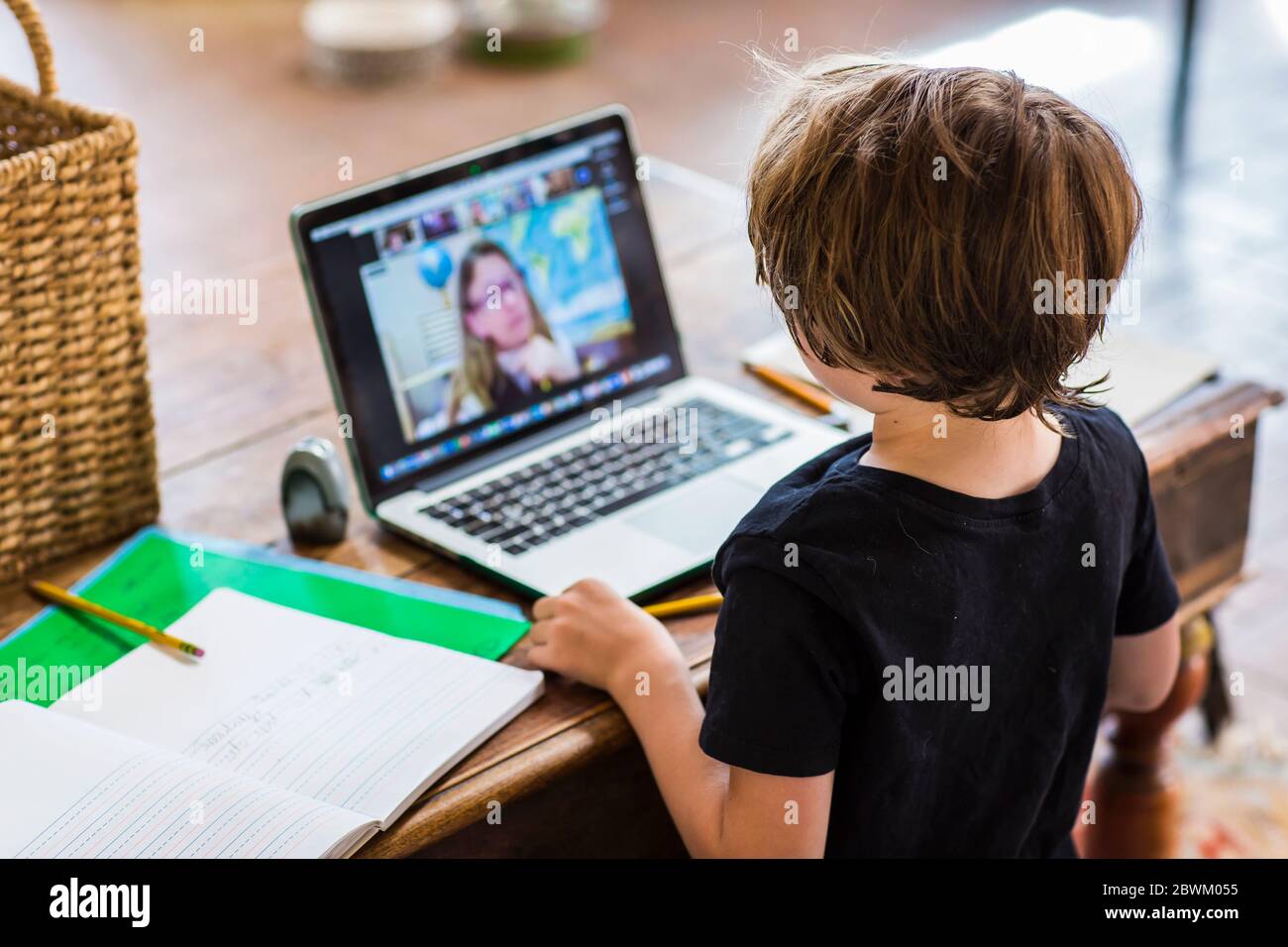 6 year old boy having a remote schooling session with his teacher Stock ...