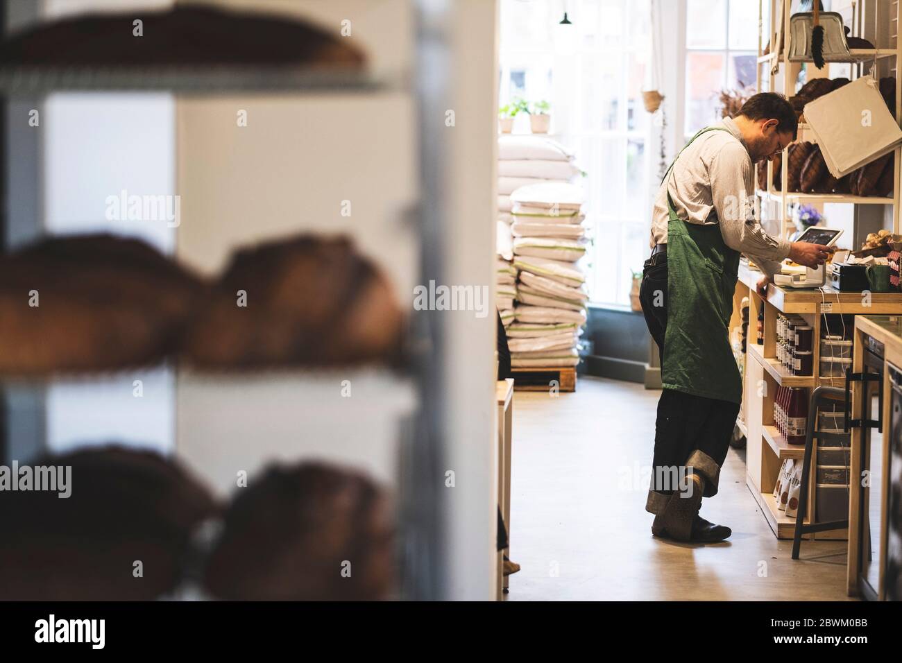 Artisan bakery making special sourdough bread, racks of bread and a ...