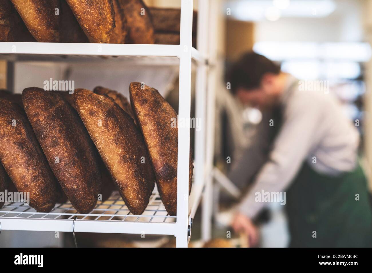 Artisan bakery making special sourdough bread, racks of bread and a ...