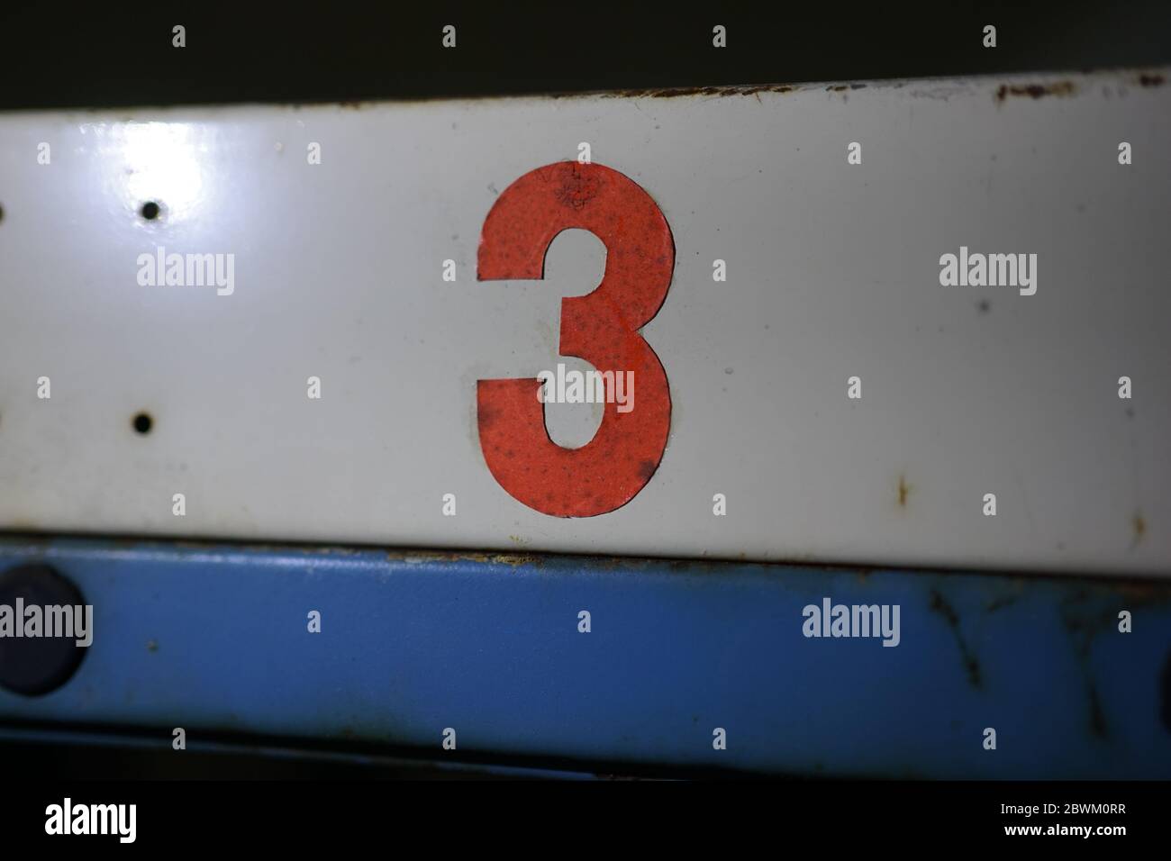 Old vintage hand painted red colored number 3 on white blue tin metal ...
