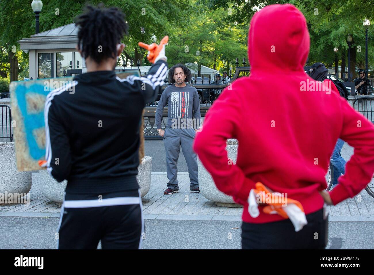 A demonstrator gives the middle finger to a supporter of United States ...