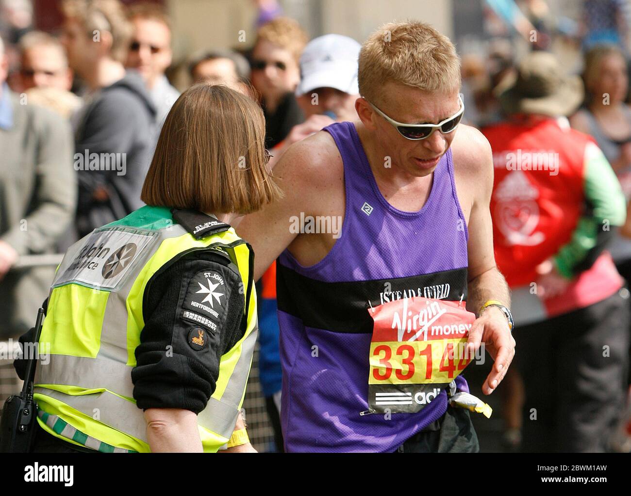 runner competing in the London Marathon suffering in the latter stages ...