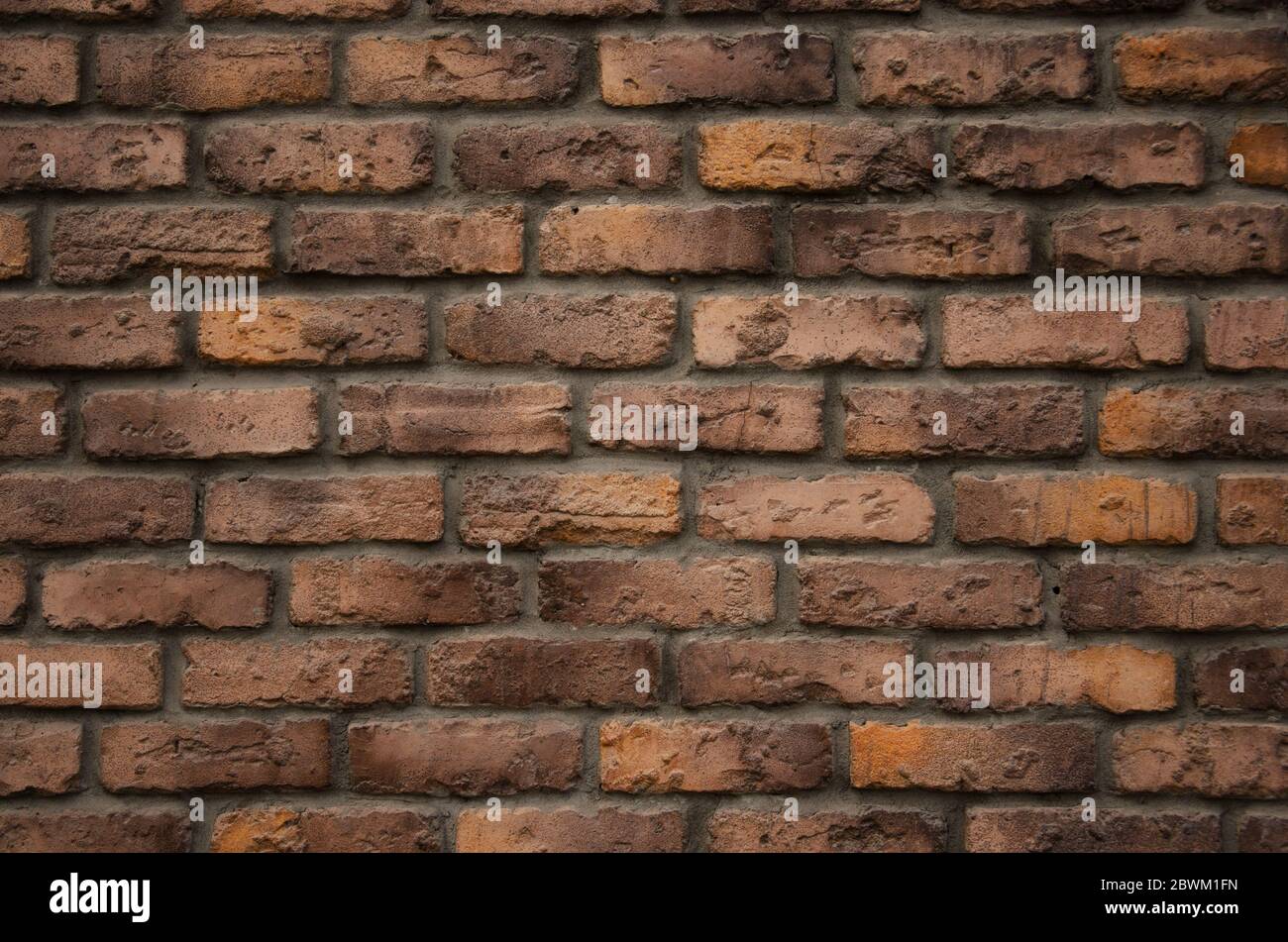Dark red and yellow brick wall background, pattern and texture Stock ...