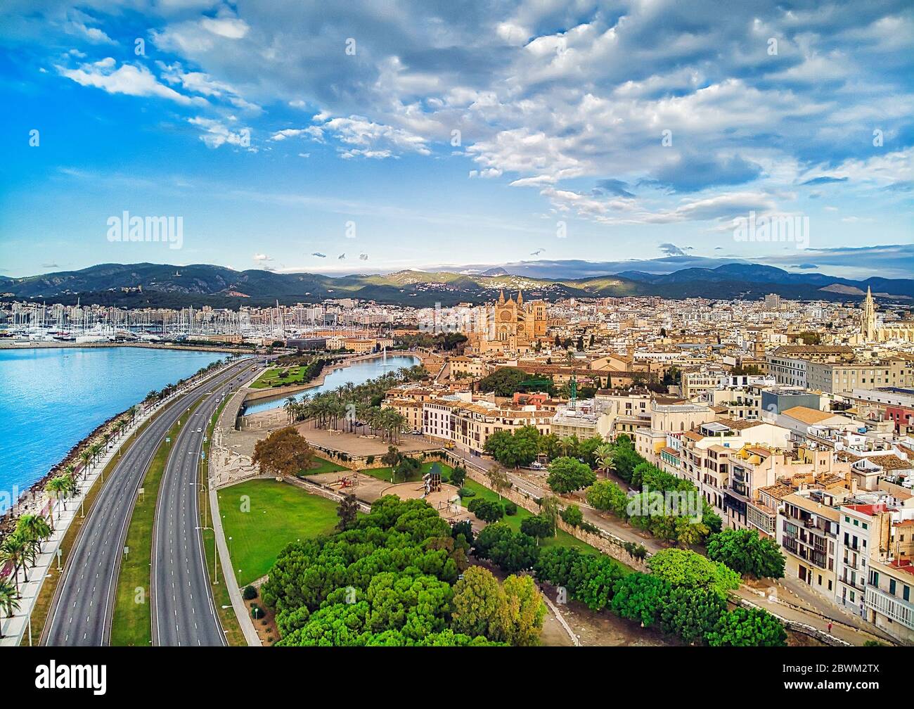 Aerial drone view Majorca cityscape, road along the coast of ...