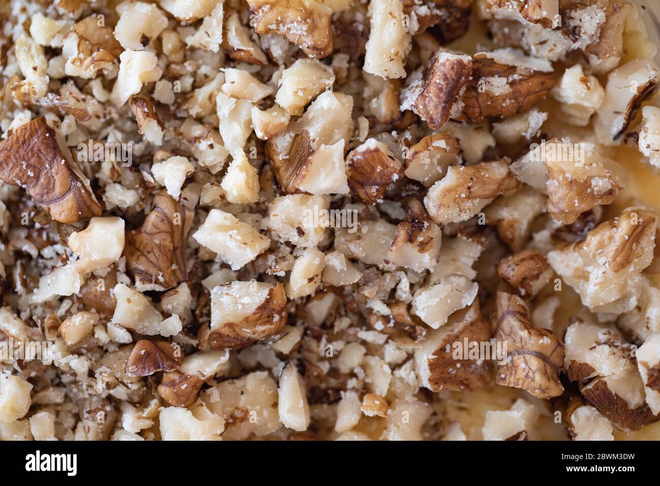 close up photo of crushed walnuts as food background or texture Stock ...