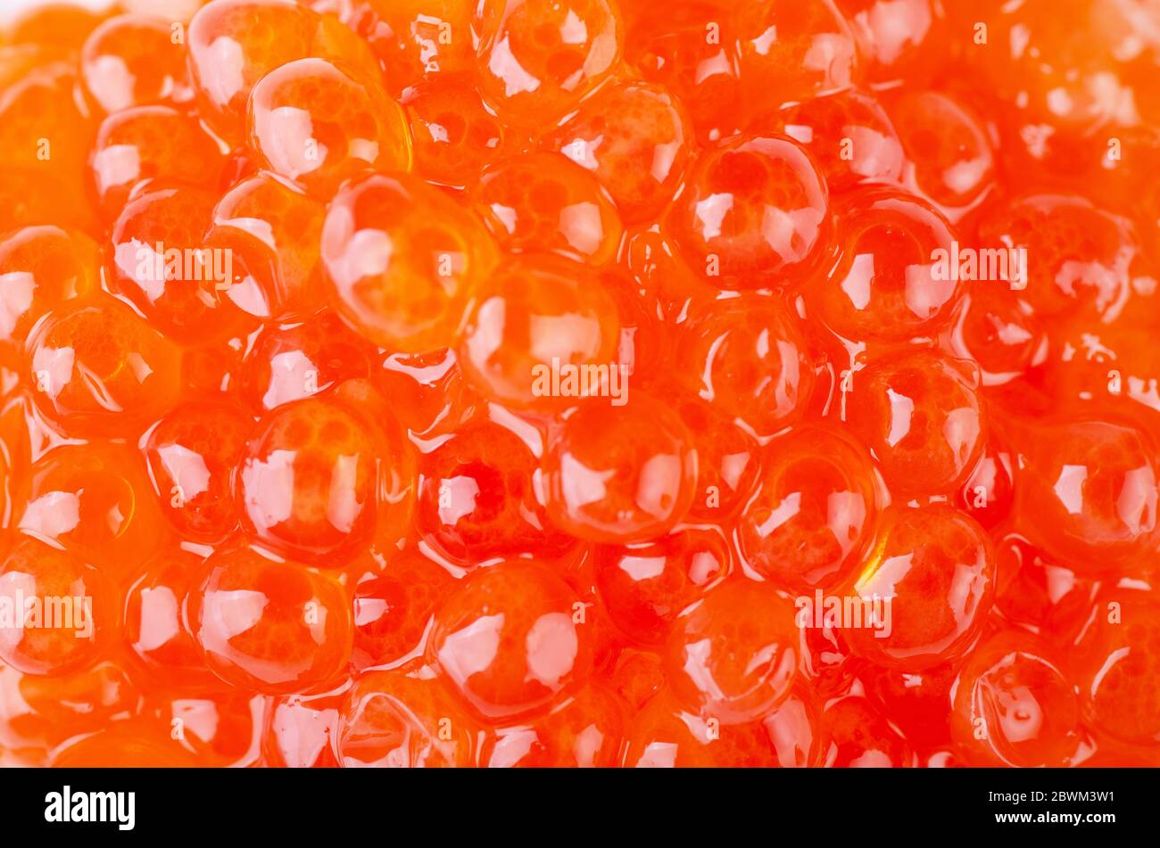 Orange or red luxury caviar as background texture pattern. Healthy sea ...