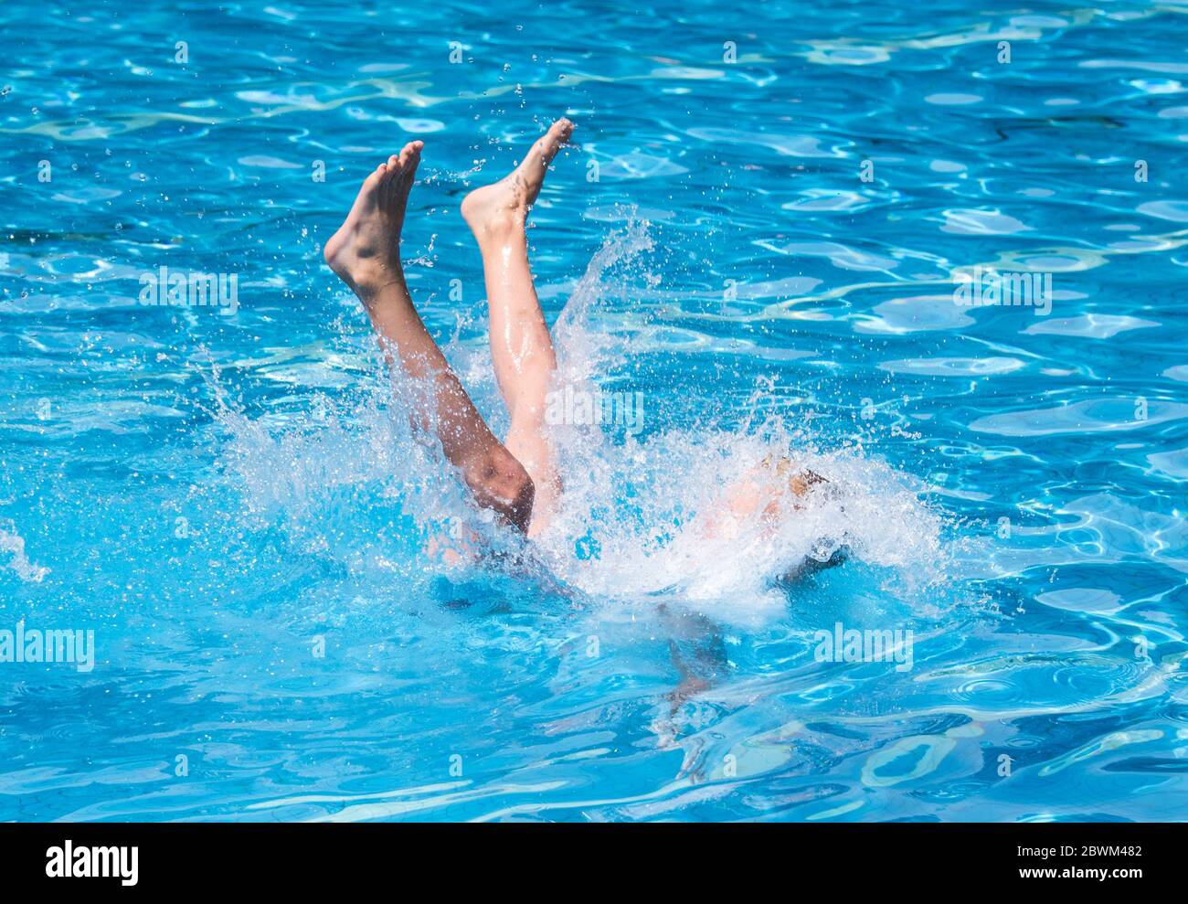 02 June 2020, Hamburg: A boy is thrown into the water in the Marienhöhe ...