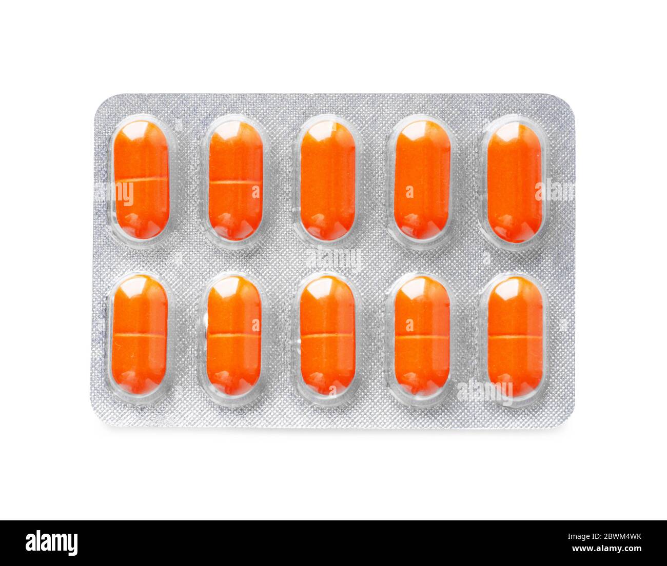 Orange pack of pills isolated on white background Stock Photo - Alamy