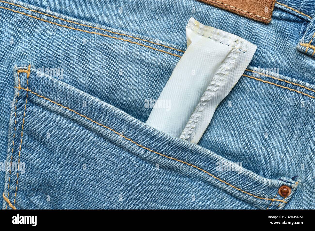 Tampon in a bag in a back pocket of jeans Stock Photo - Alamy