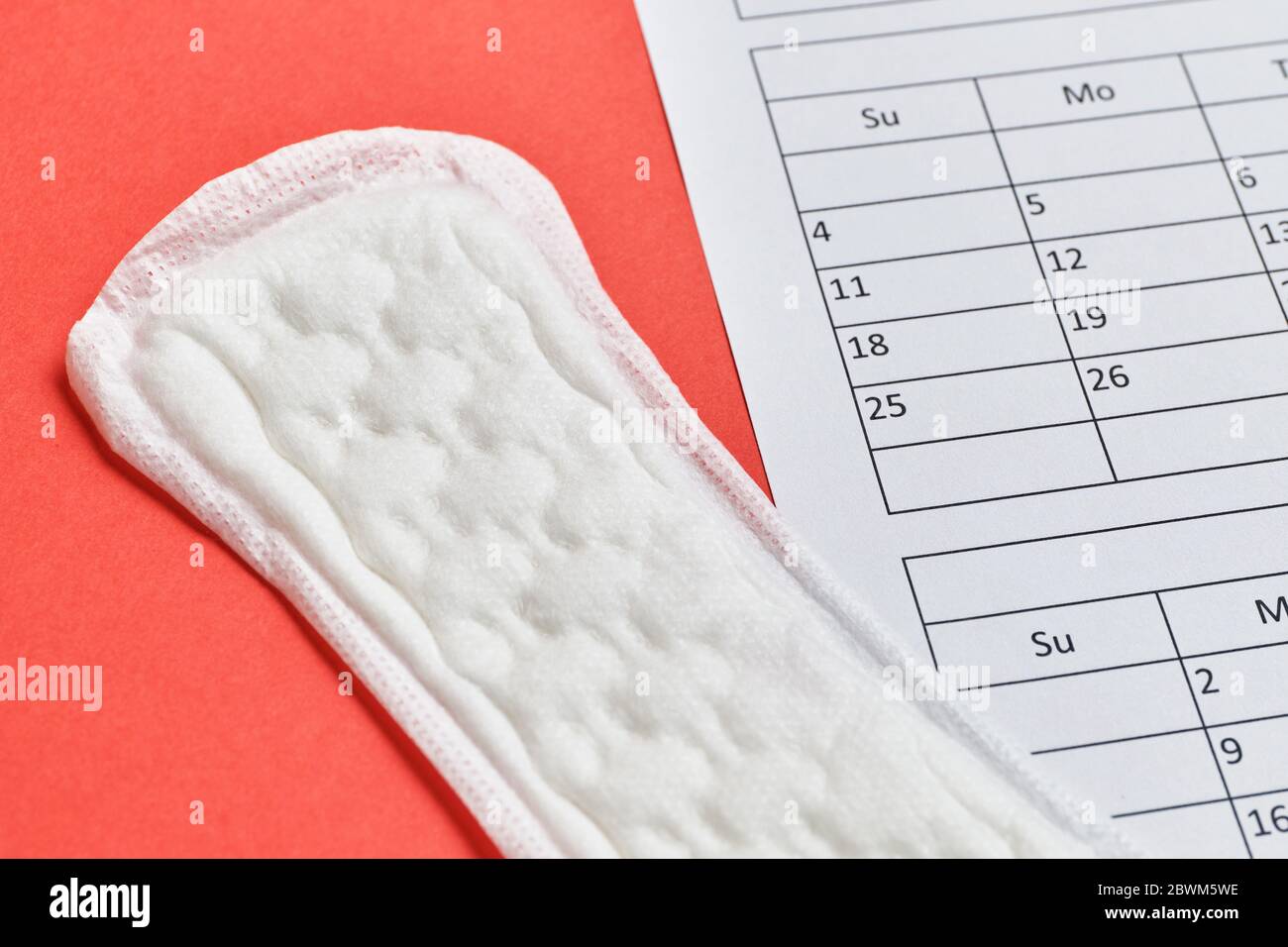 Gasket next to the calendar and red background Stock Photo - Alamy