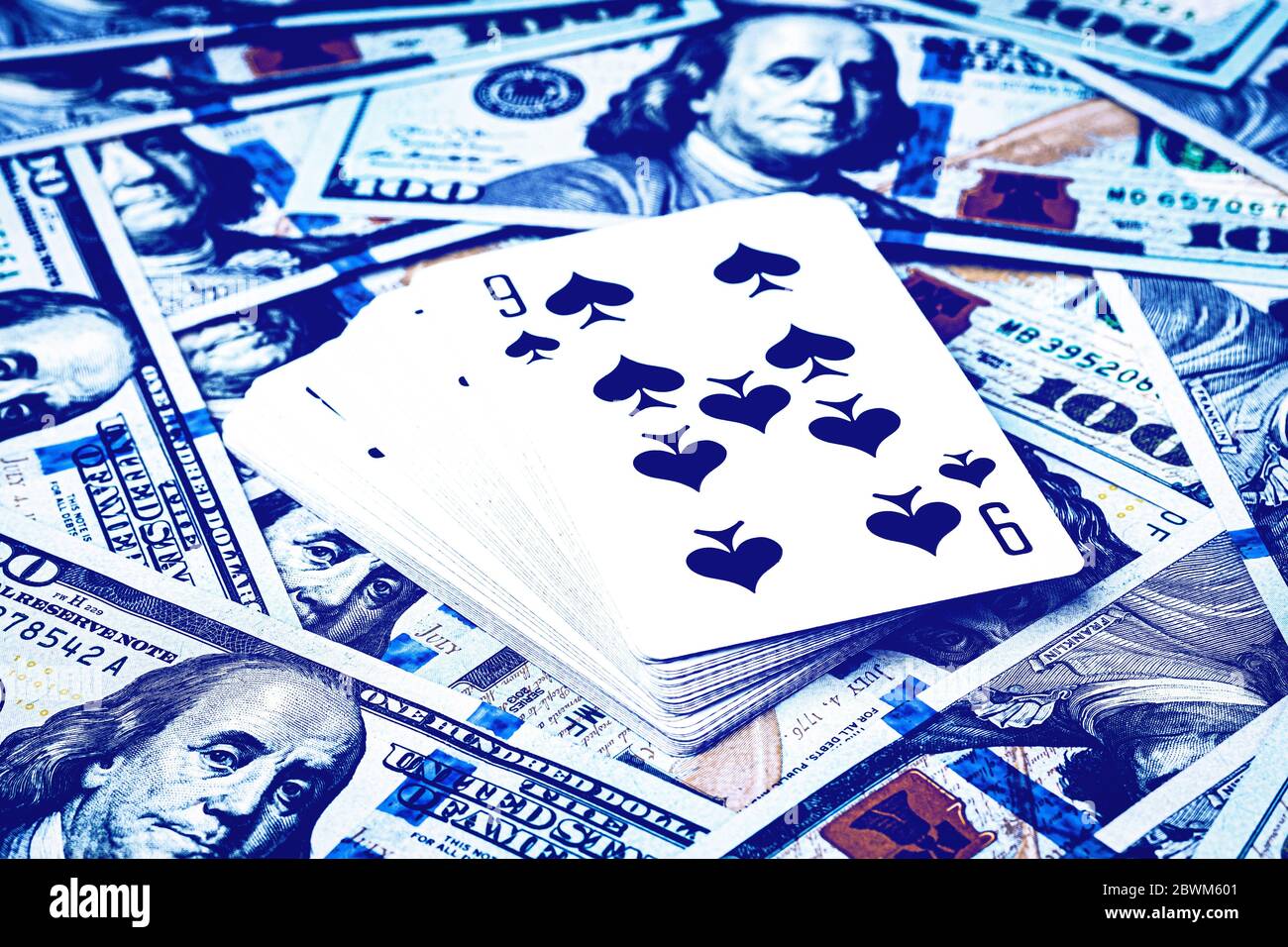 Hundred dollar bills and a deck of playing cards. Money gambling ...