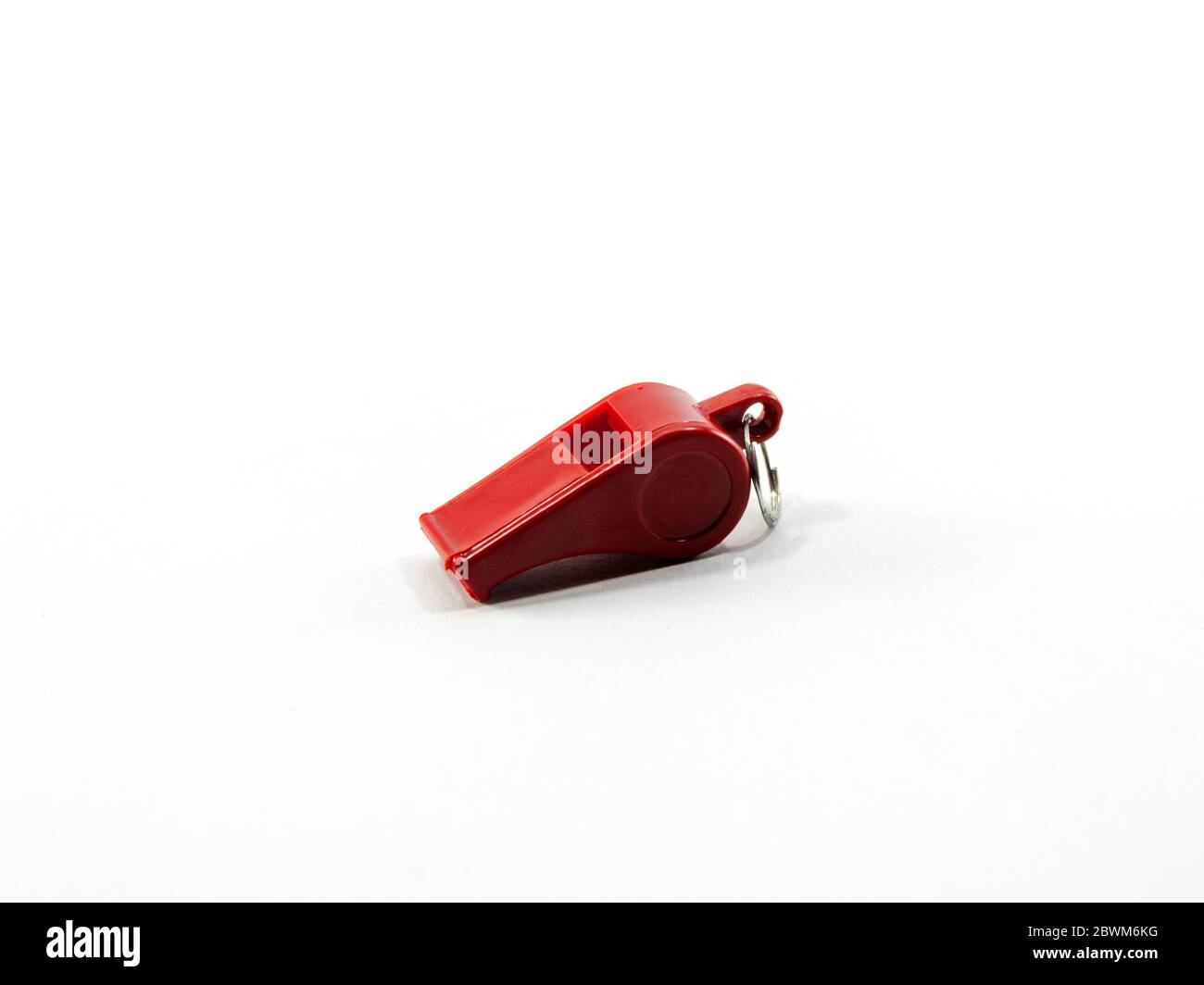 Red whistle is a white background Stock Photo - Alamy