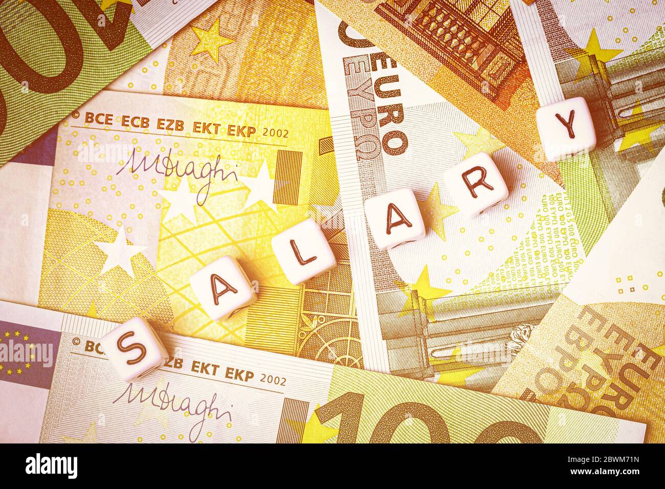 Beaded inscription "salary" and euro notes Stock Photo - Alamy