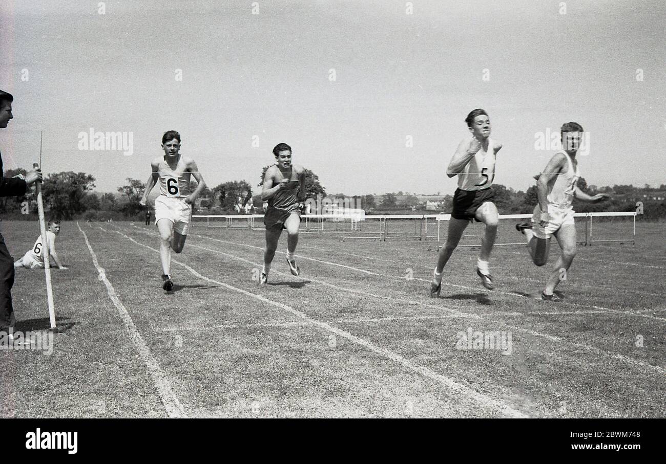 1950s, historical, summertime and a school sports day, four teenage ...