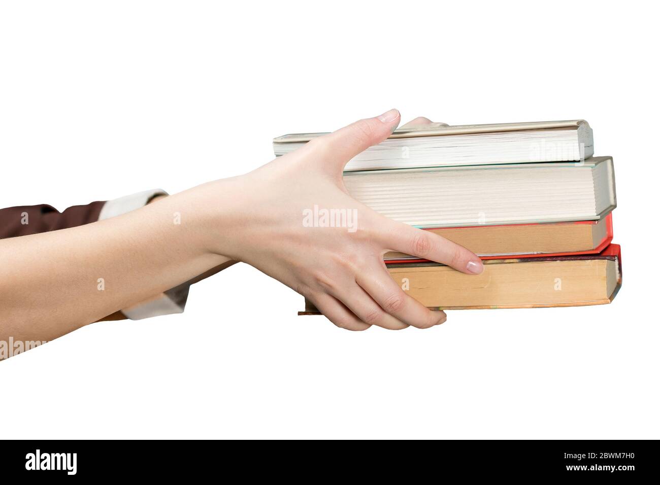 girls hands hold a stack of books in front of them. side view, isolated ...