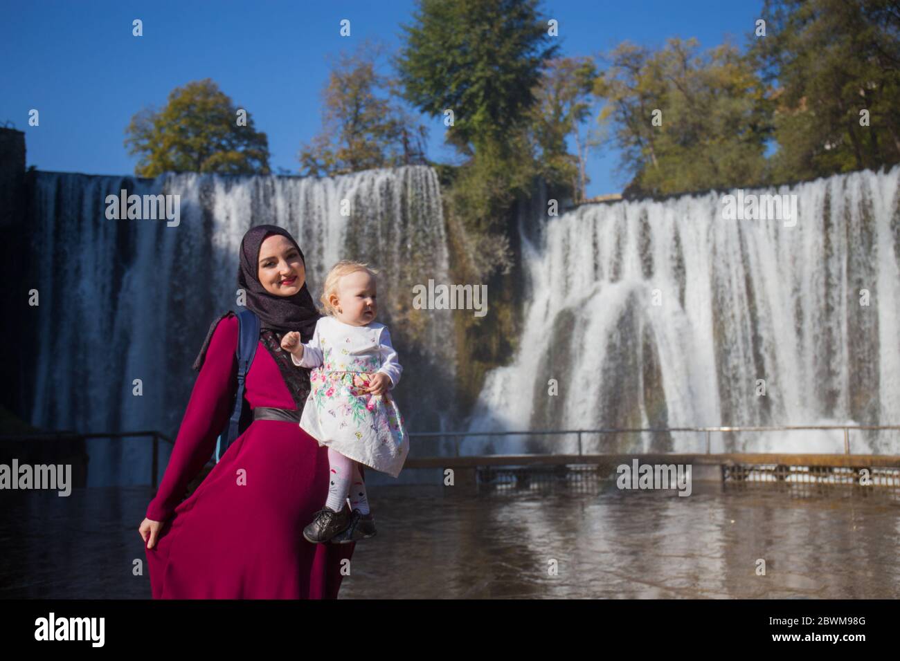Grass is standing with a river with a waterfall hi-res stock ...