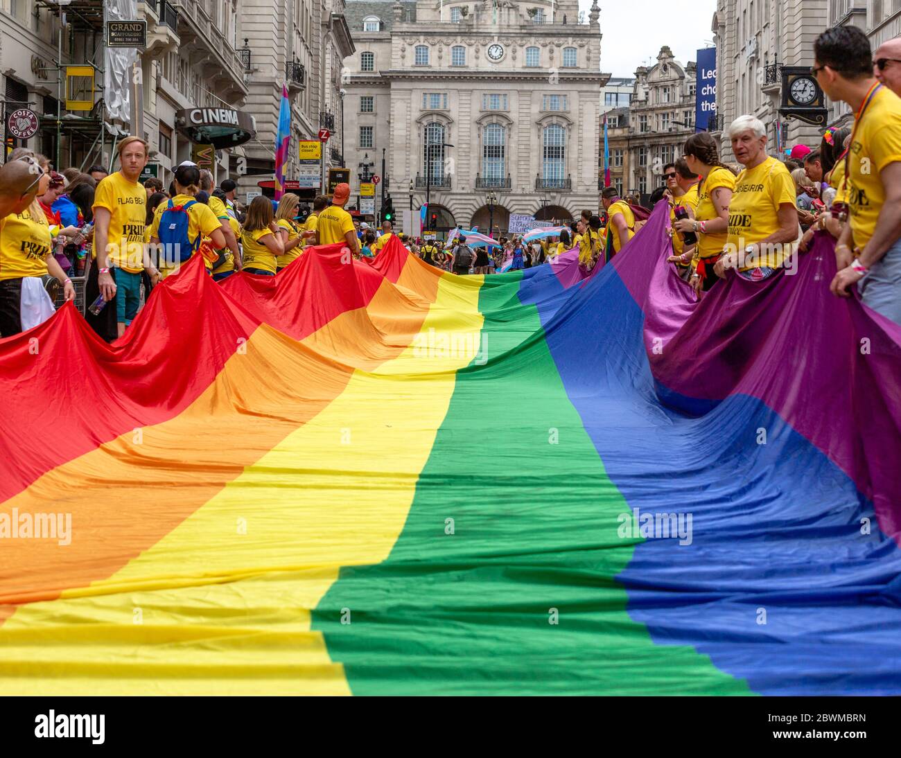 LONDON, ENGLAND - JULY 06: Pride volunteers with Pride flag during ...
