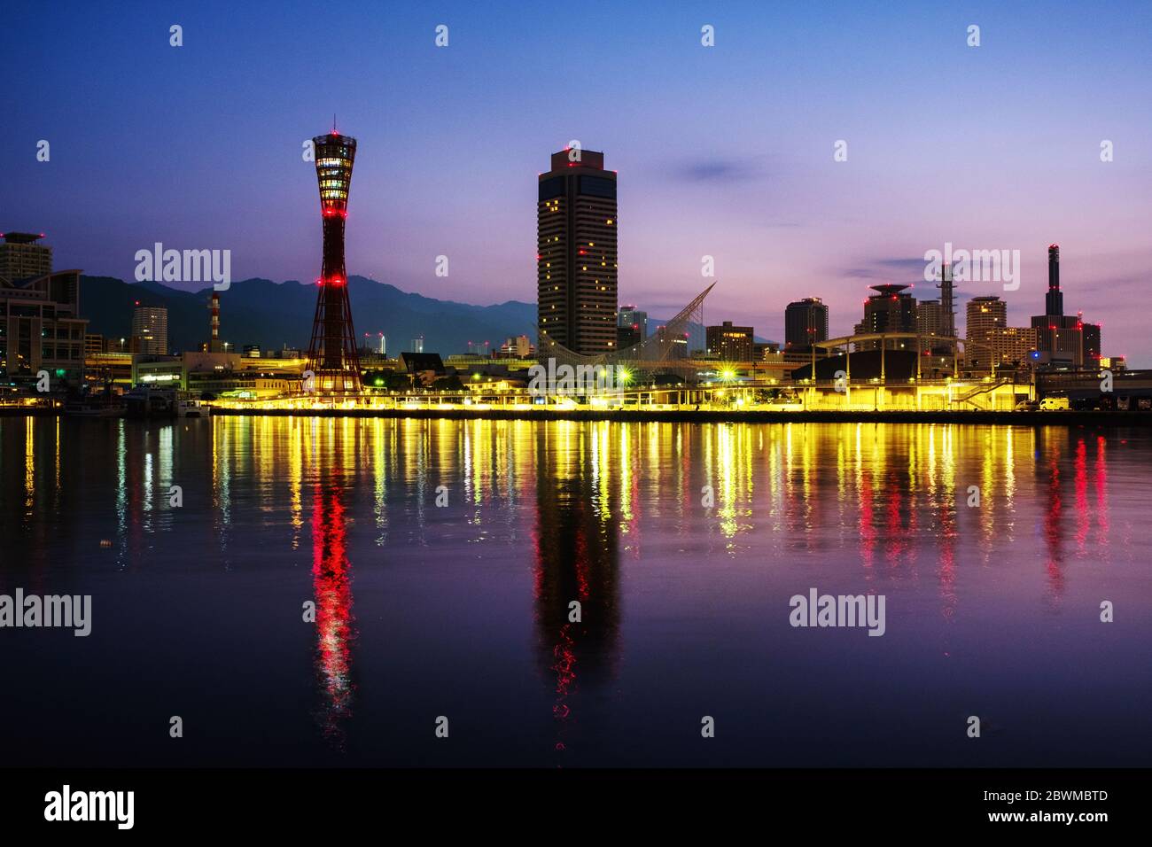 Kobe, Japan. View of sunrise in Kobe, Japan. Cloudless sky with harbor ...