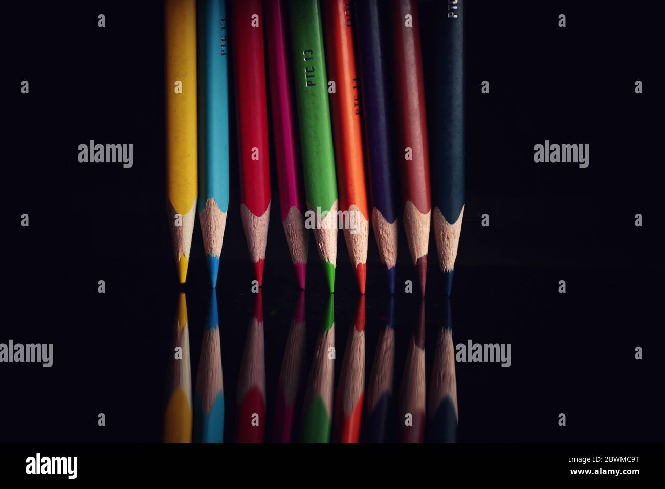 Pencil colours reflection on black background Stock Photo - Alamy