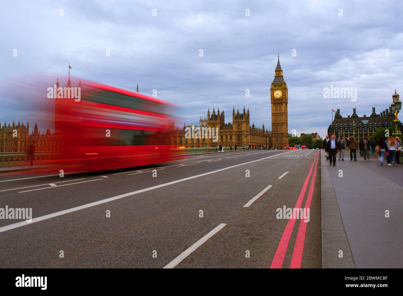 London, UK. Cloudy sky over the city of London, UK. Westminster and Big Ben during the day. Red ...