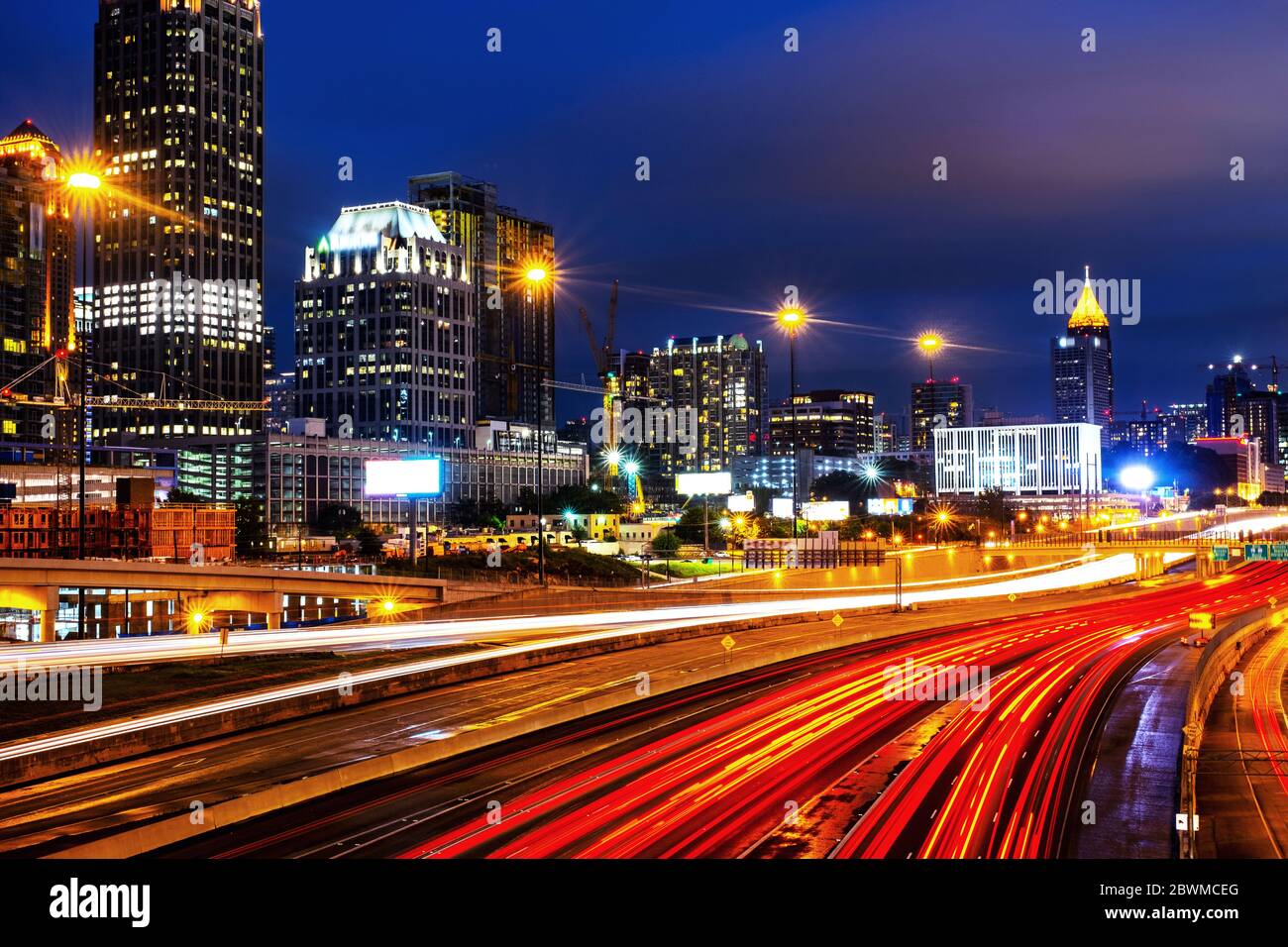 Atlanta, USA. Illuminated Midtown in Atlanta, USA at night. Car traffic ...