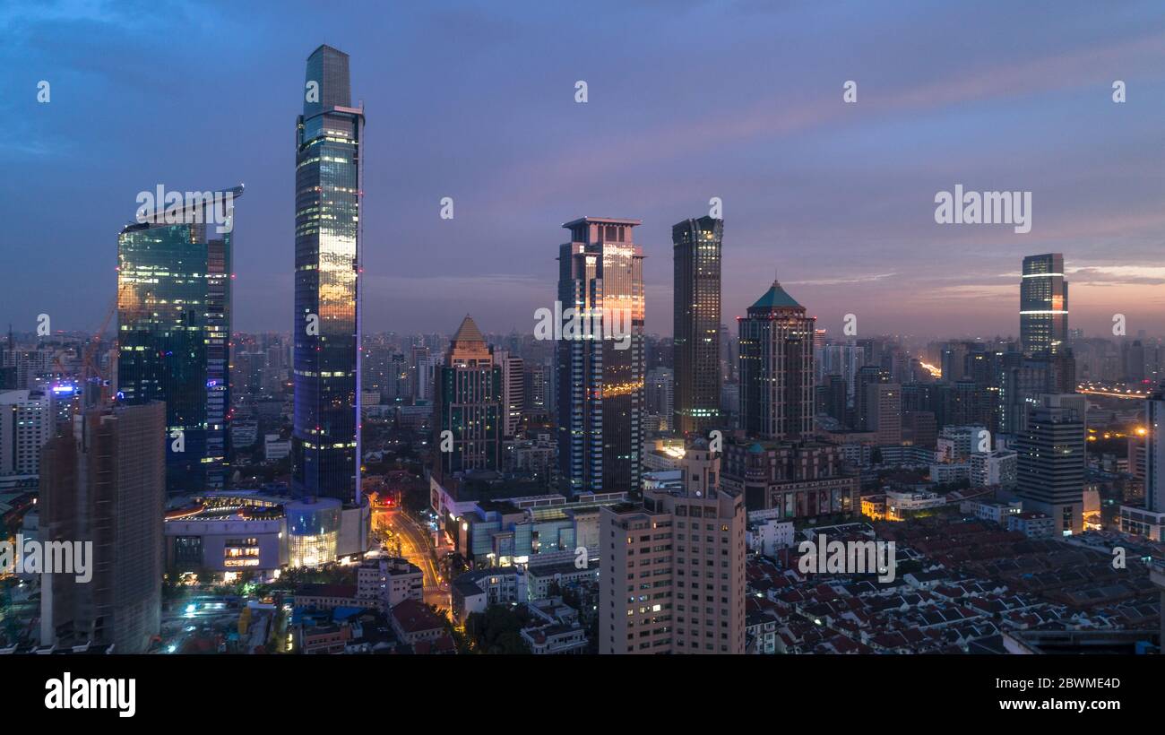 colorful reflection of dawn light on glass of buildings windows, Jingan ...