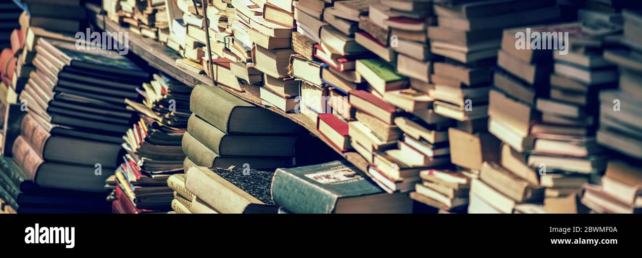 Stack of books at the bookshop old books banner Stock Photo - Alamy