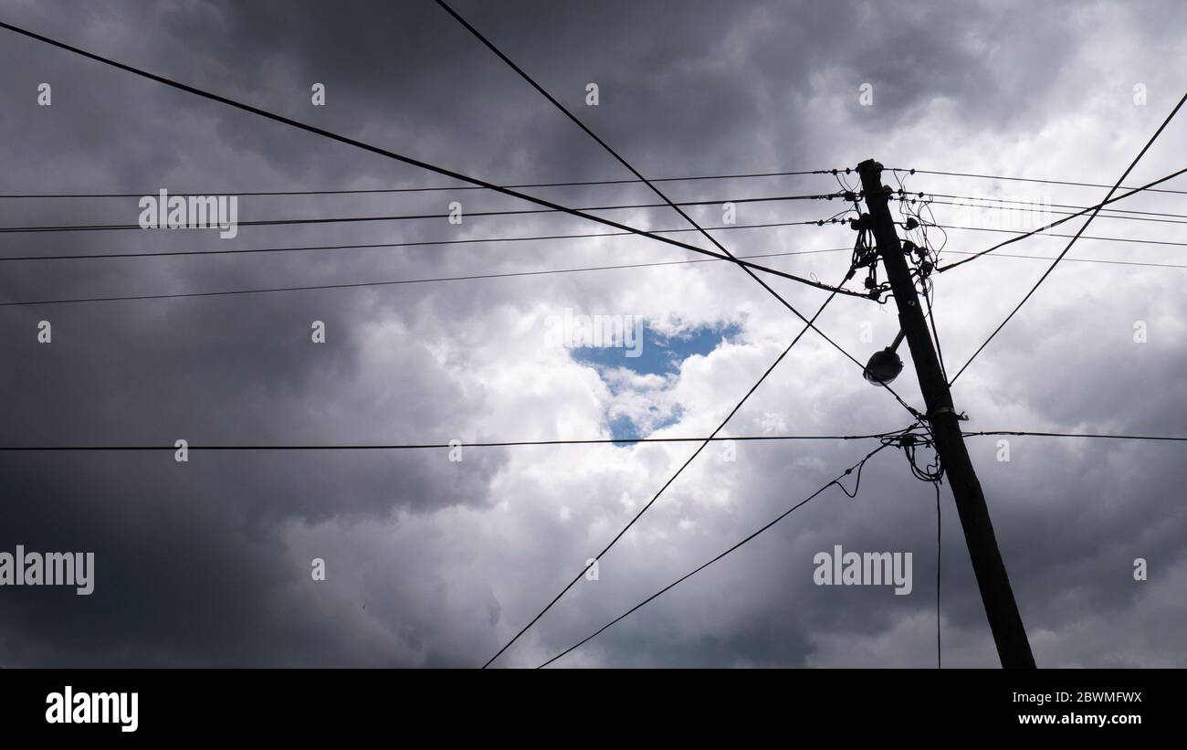 Electric pole with lightning rod against the stormy sky Stock Photo - Alamy