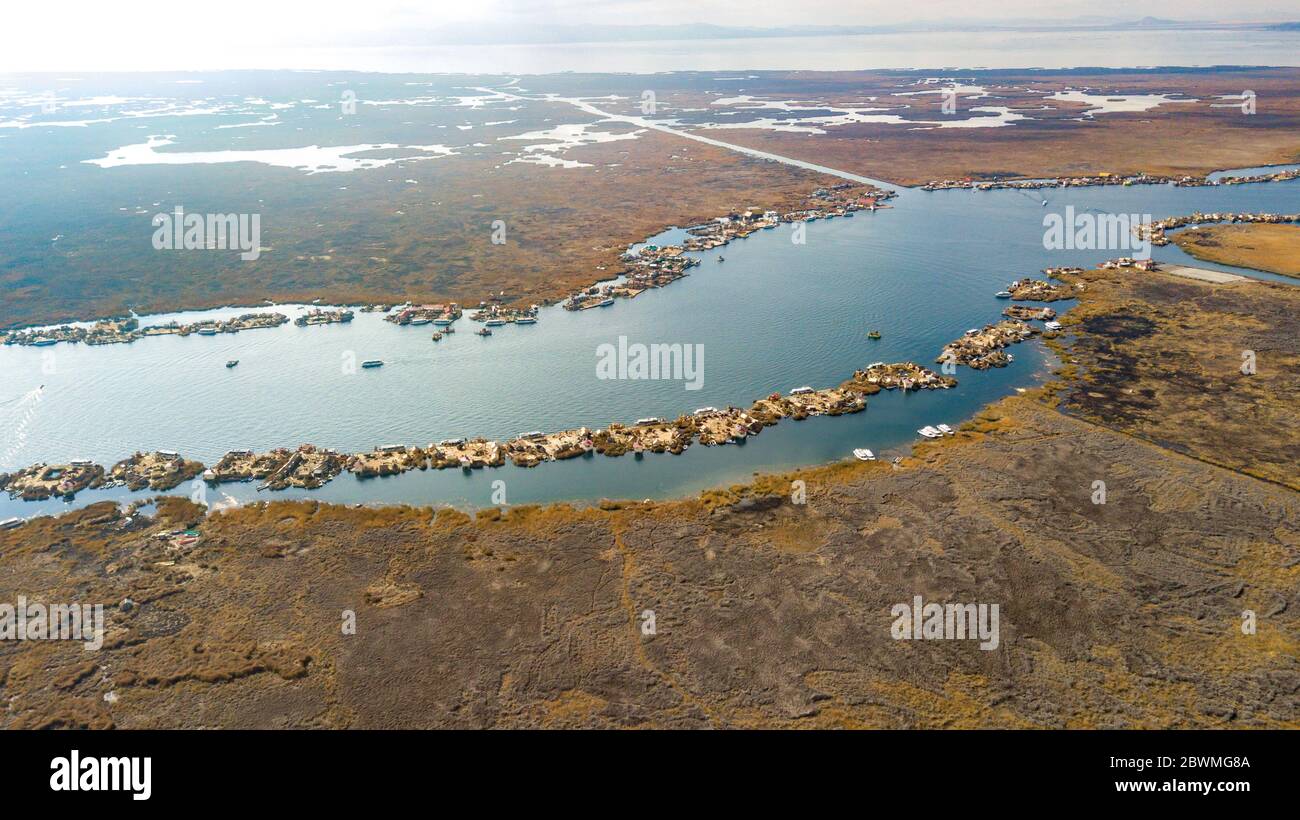 An aerial high view of Uros floating islands settlements at Lake ...
