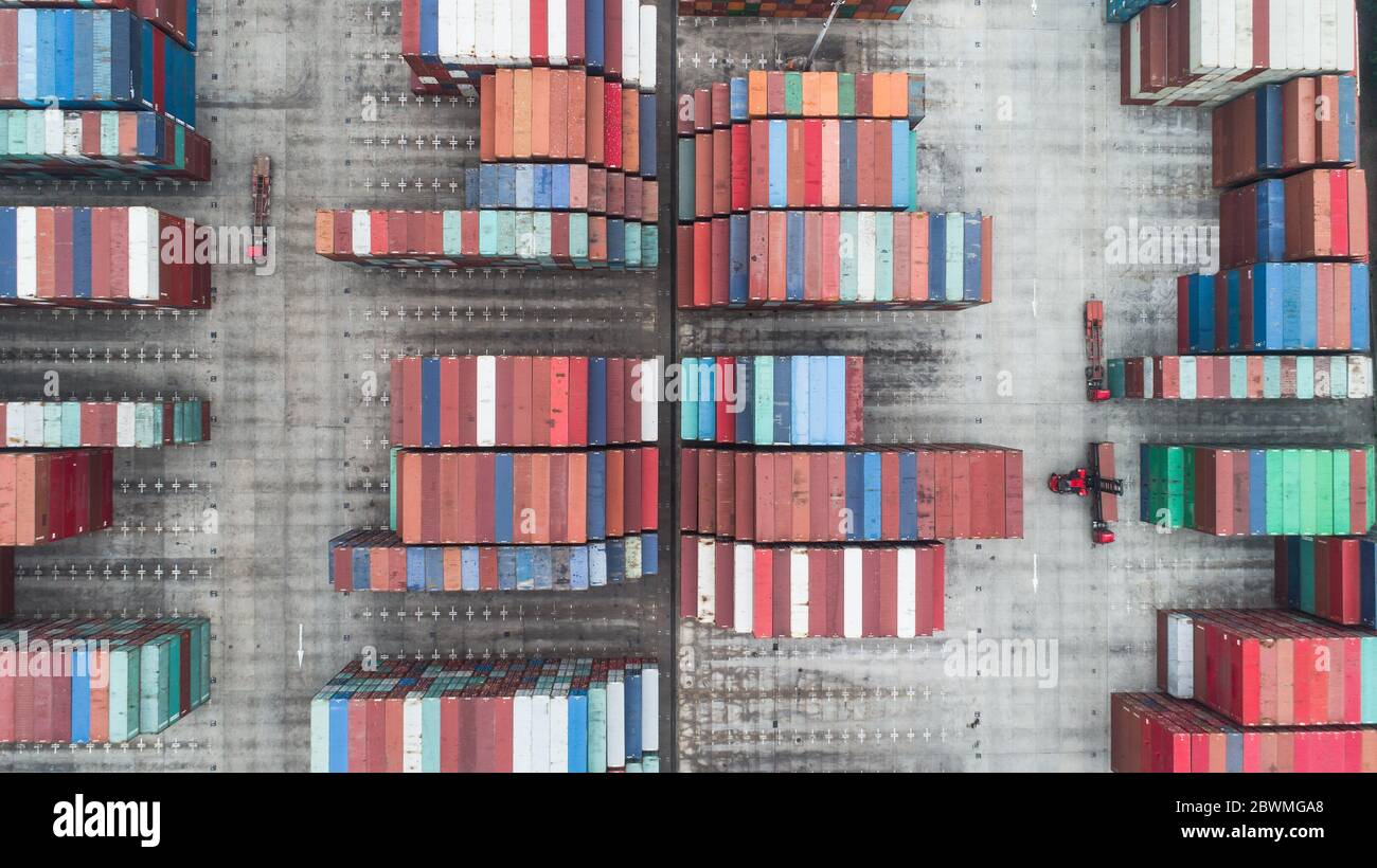 aerial view of loading and moving containers on container yard Stock ...